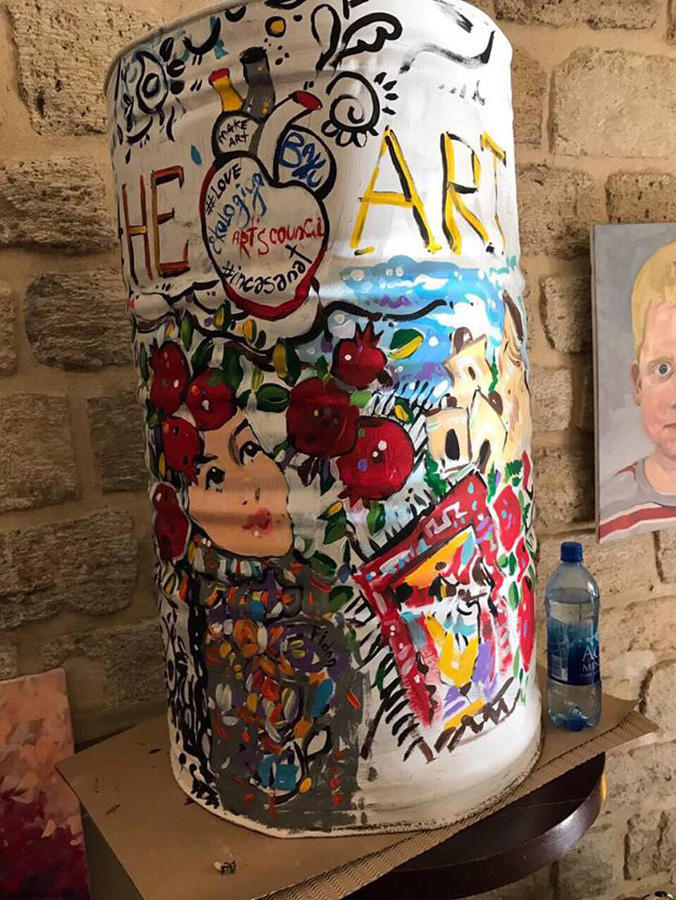 Colorful painting ideas turn barrels into piece of art [PHOTO]