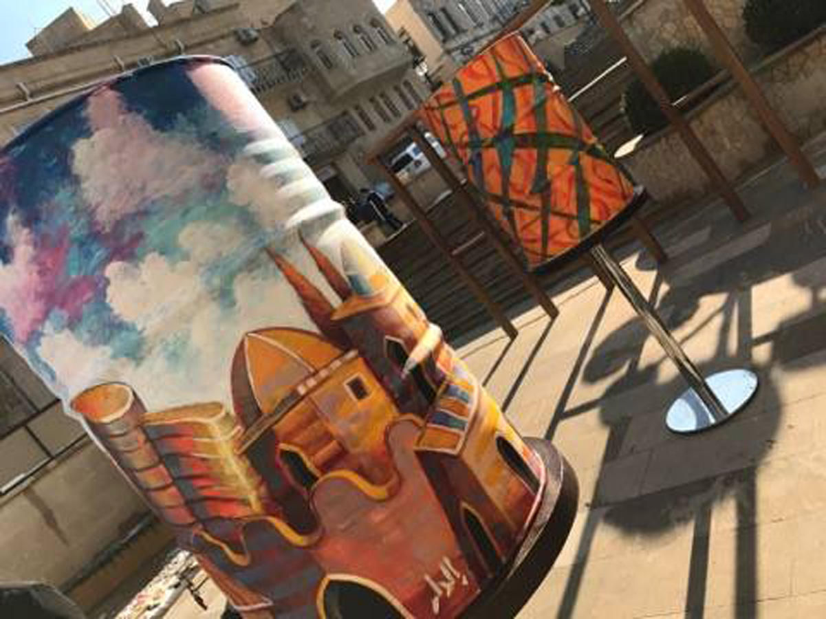 Colorful painting ideas turn barrels into piece of art [PHOTO]