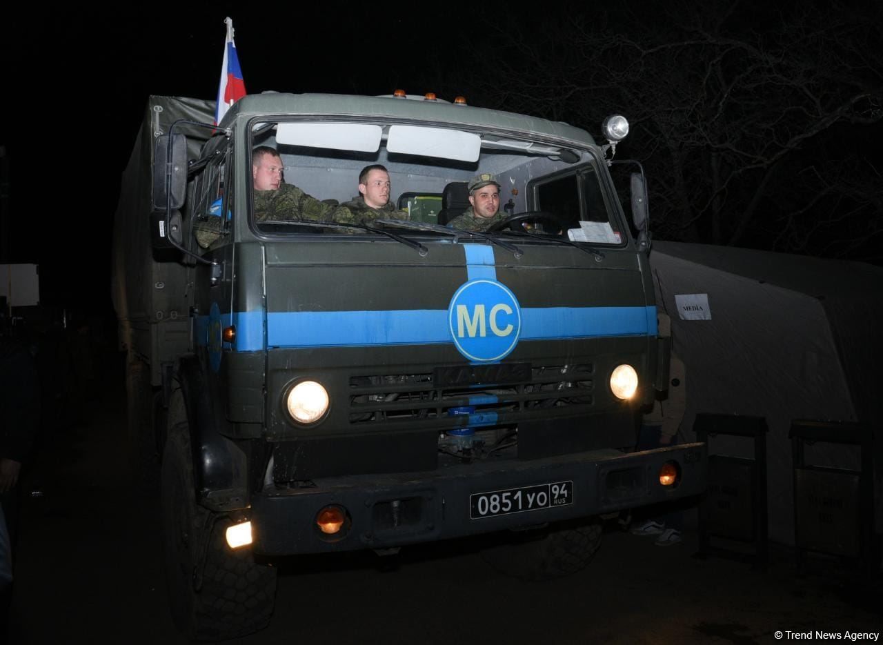Russian peacekeepers' supply vehicles pass along Lachin road without ...