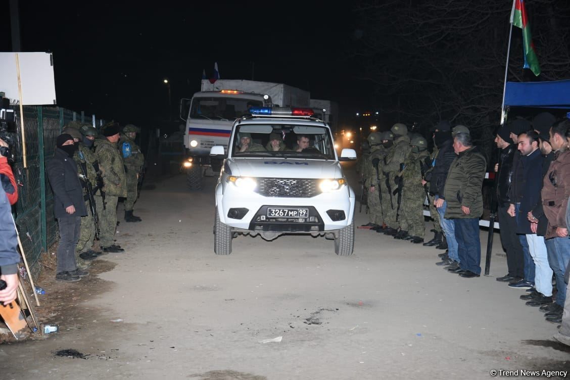 Russian peacekeepers' supply vehicles pass along Lachin road without ...