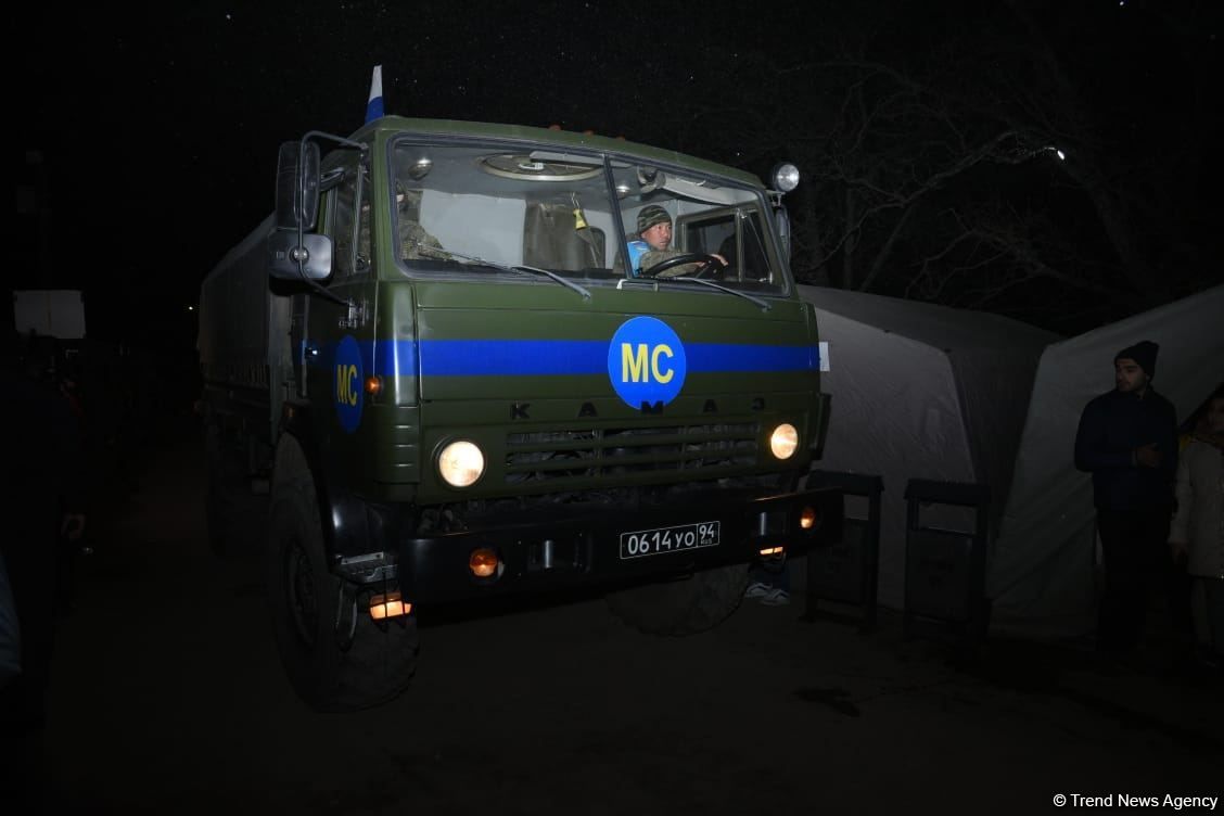 Russian peacekeepers' supply vehicles pass along Lachin road without ...