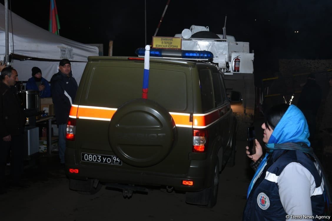 Russian peacekeepers' supply vehicles pass along Lachin road without ...