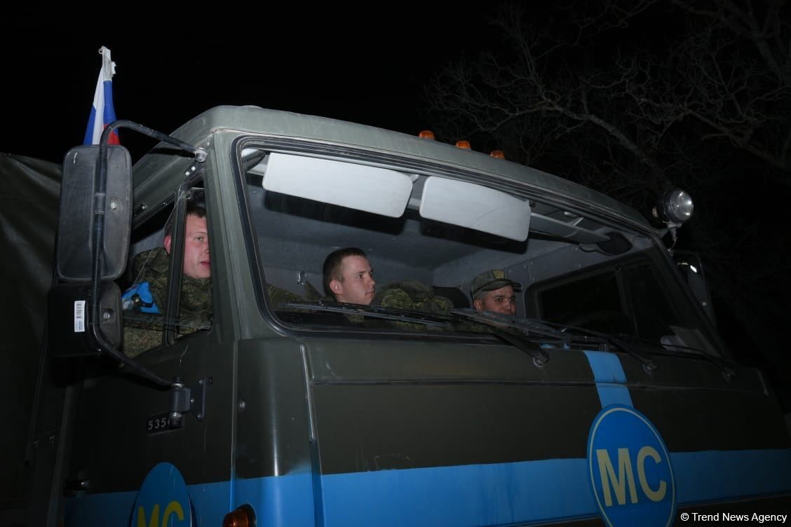Russian peacekeepers' supply vehicles pass along Lachin road without ...