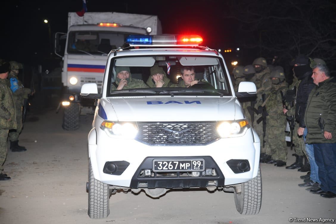 Russian peacekeepers' supply vehicles pass along Lachin road without ...