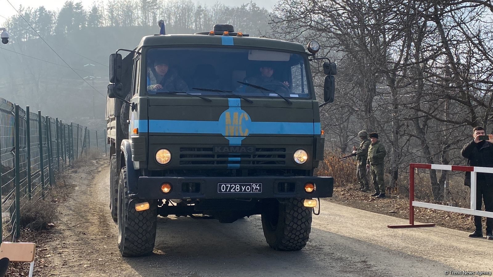 Vehicles of Russian peacekeepers keep passing along Azerbaijan's Lachin ...