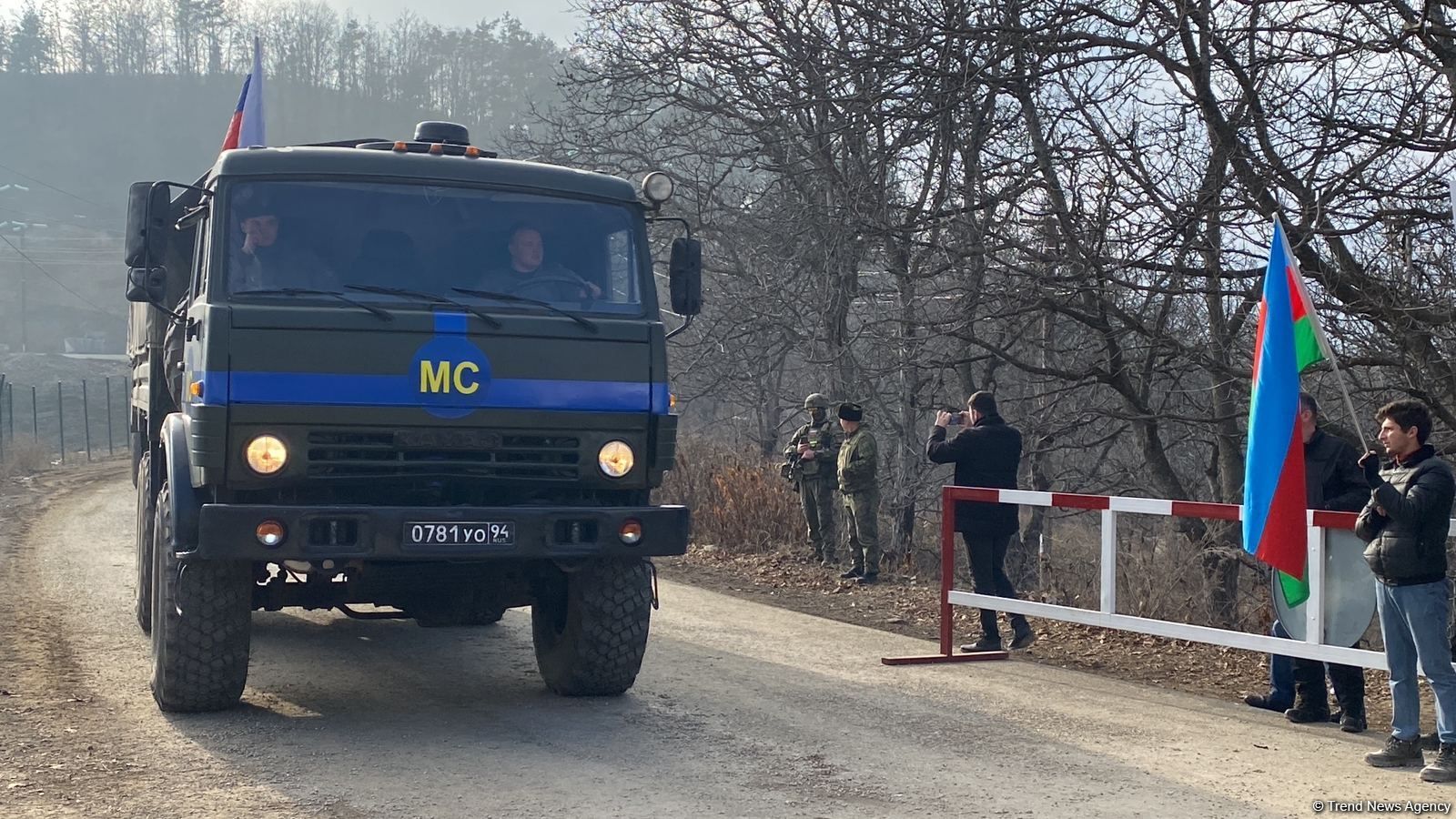 Vehicles of Russian peacekeepers keep passing along Azerbaijan's Lachin ...